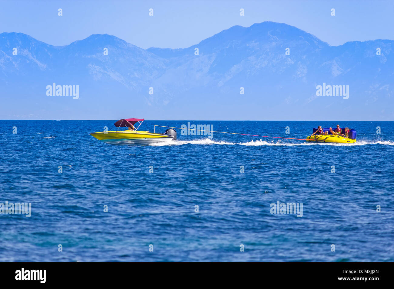 Children water sport adventure on the sea Stock Photo - Alamy