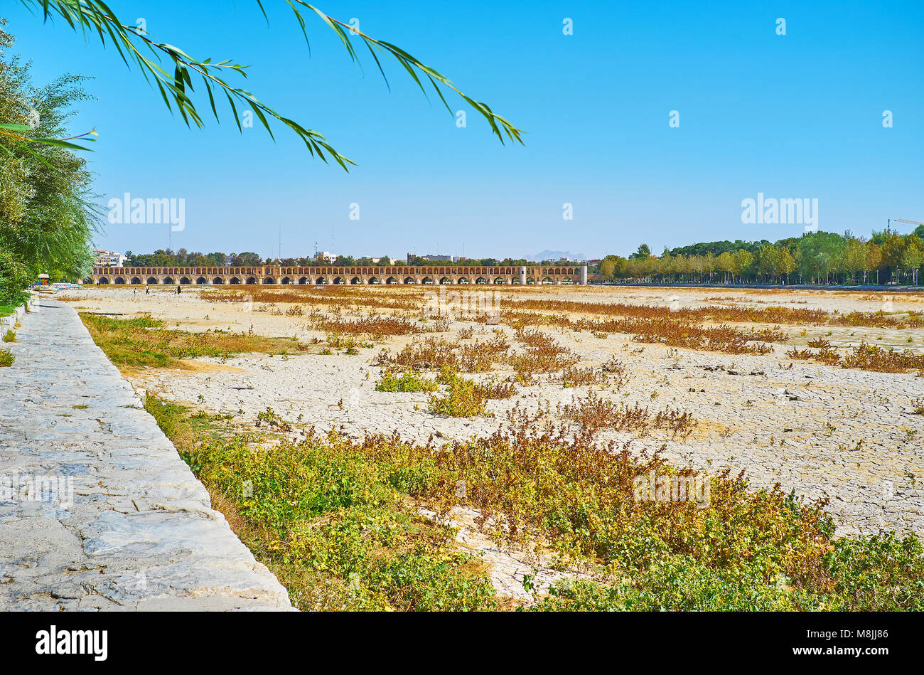The walk along the bank of dried up Zayandeh river with a view on Si-o ...