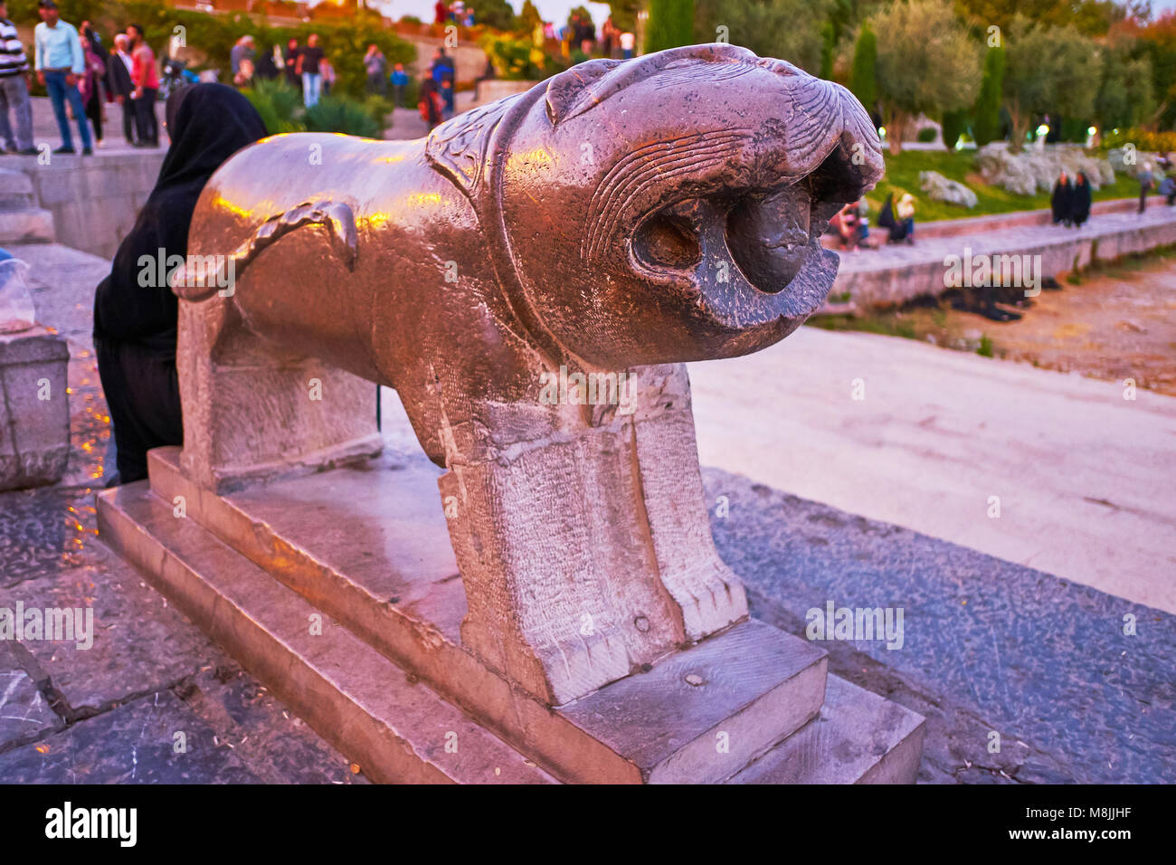 The medieval stone statue of lion at the Khaju bridge in Isfahan, Iran ...