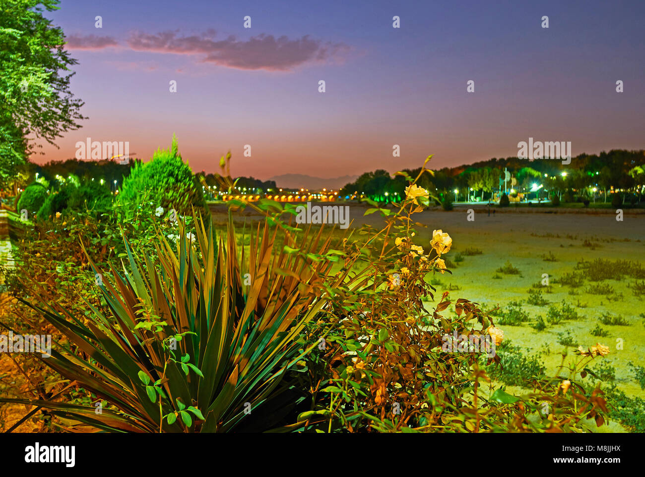 The lush greenery and scenic flower beds in Moshtagh-e Aval riverside ...