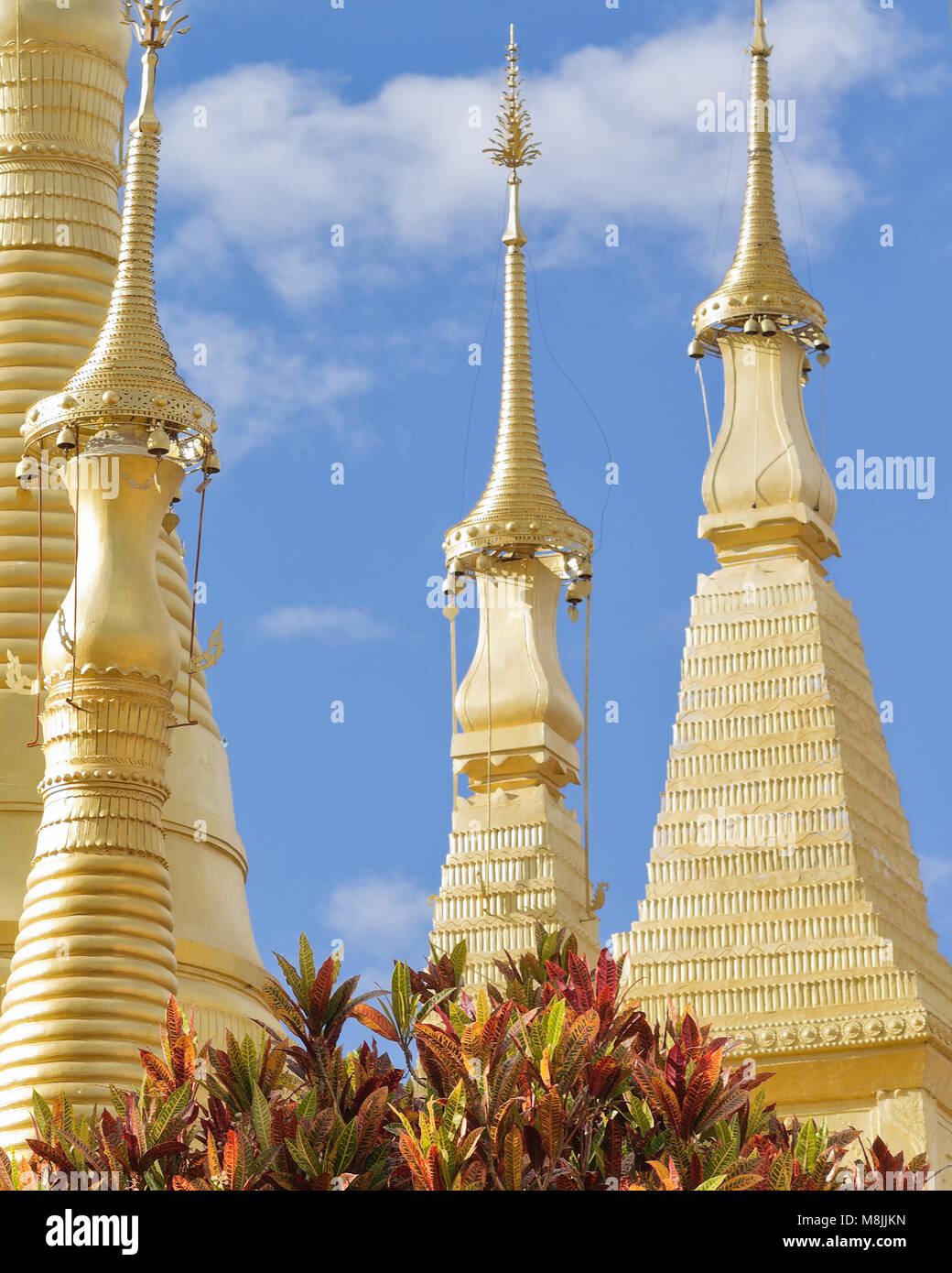 The gilded tops of Buddhist pagodas Stock Photo - Alamy