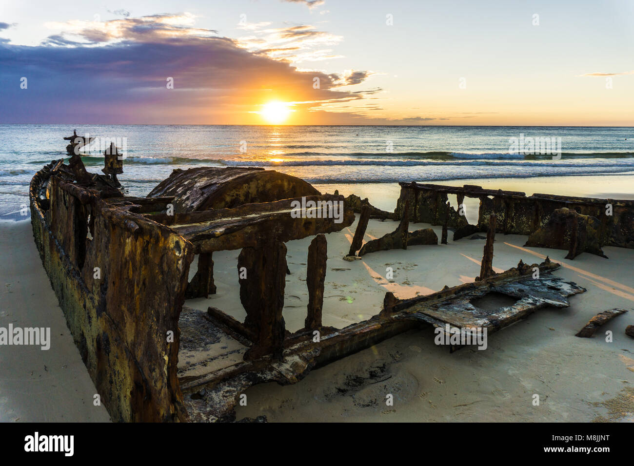 Shipwreck Sunset on Moreton Island, Queensland, Australia Stock Photo ...