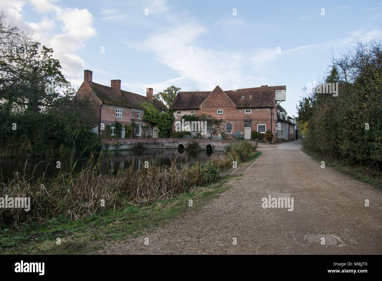 Flatford Mill bridge arch farm building buildings grass trees chimney ...