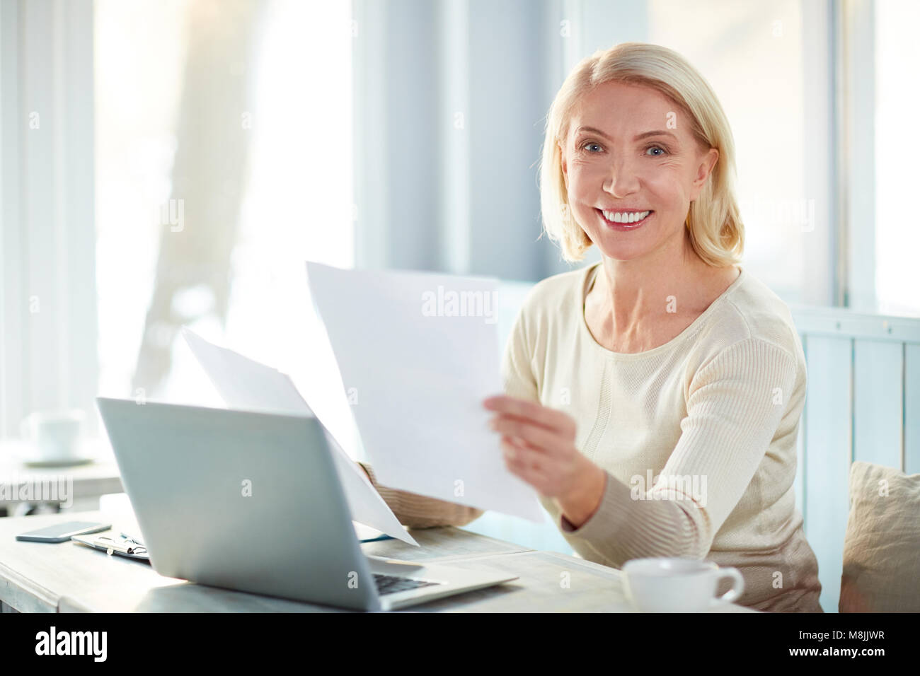 Woman with papers Stock Photo - Alamy