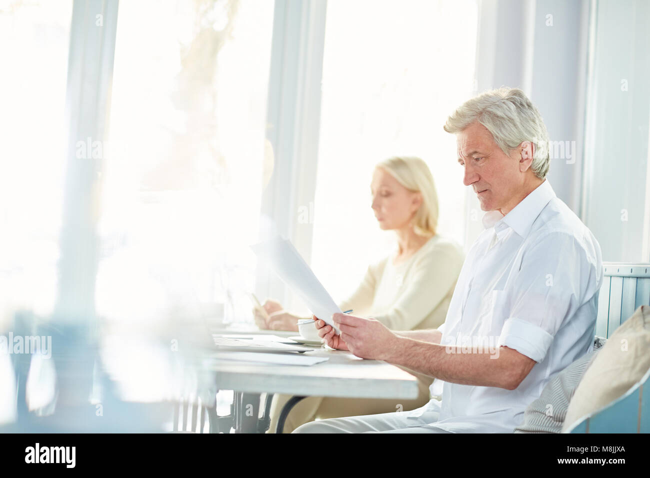 Agent with papers Stock Photo - Alamy