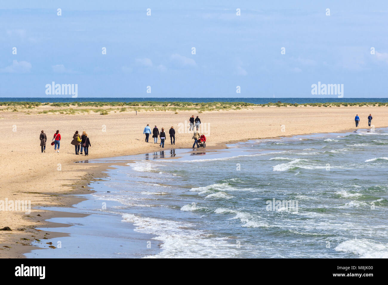 People who walk on the sandy beach Stock Photo - Alamy