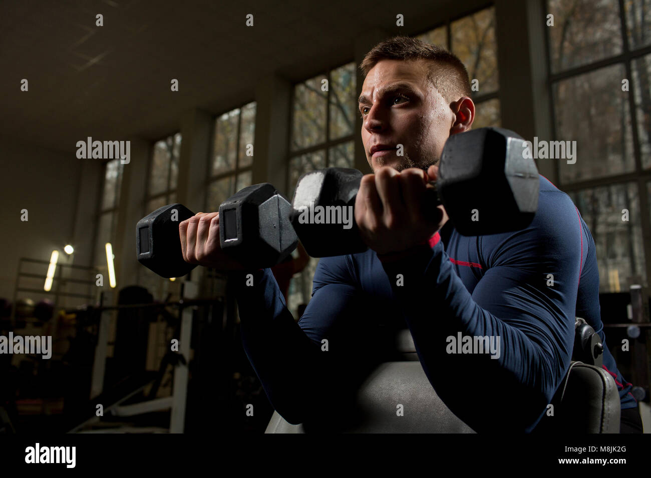 Sporty young man exercising hi-res stock photography and images - Alamy