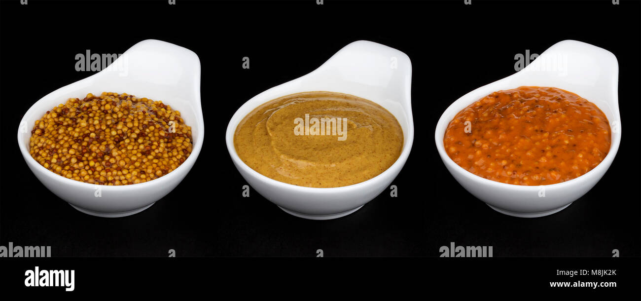 Set of various types of mustard on black background Stock Photo - Alamy