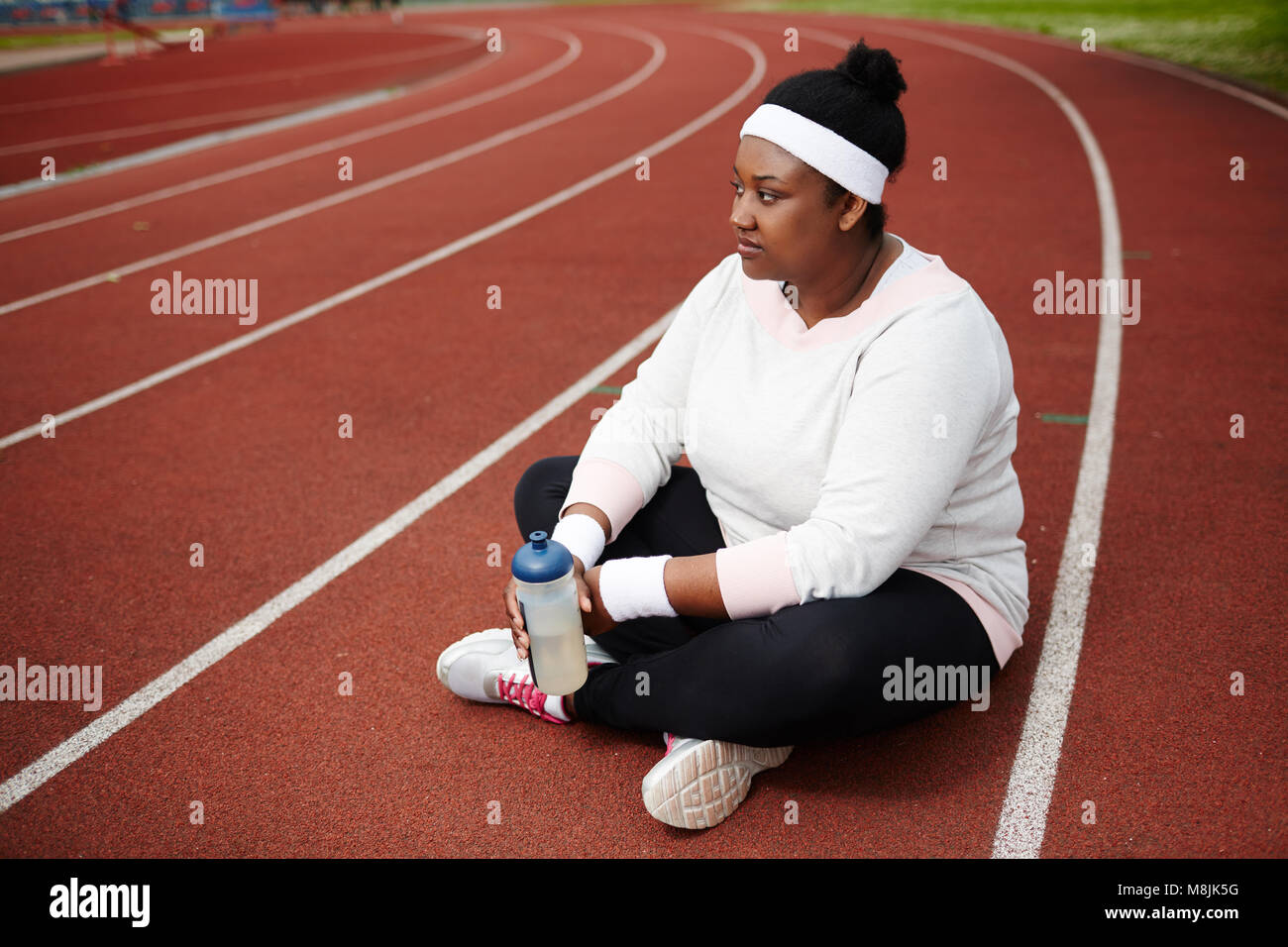 Woman on stadium track hi-res stock photography and images - Alamy