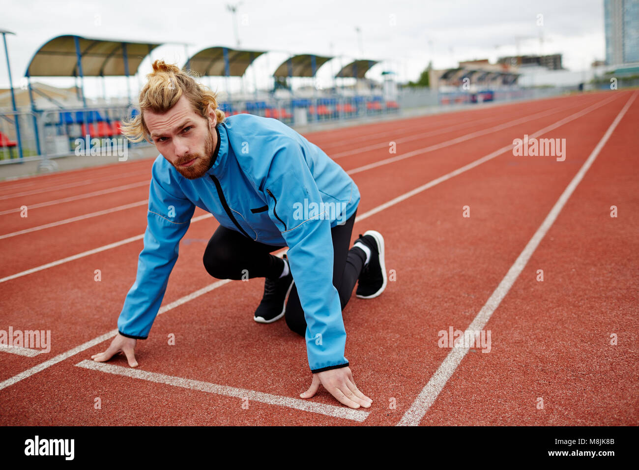 Sportsman on race track Stock Photo - Alamy