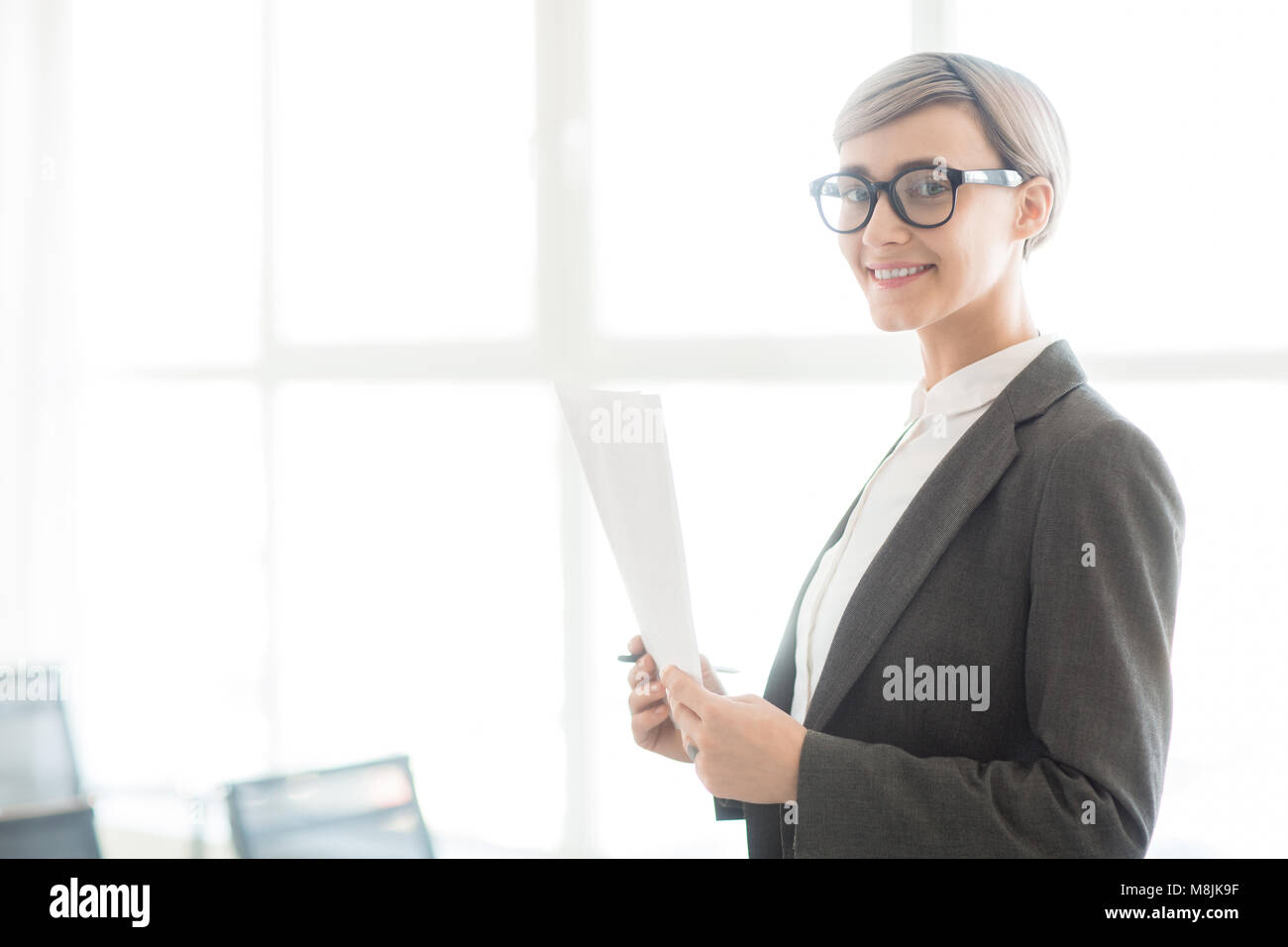 Young happy business manager hi-res stock photography and images - Alamy