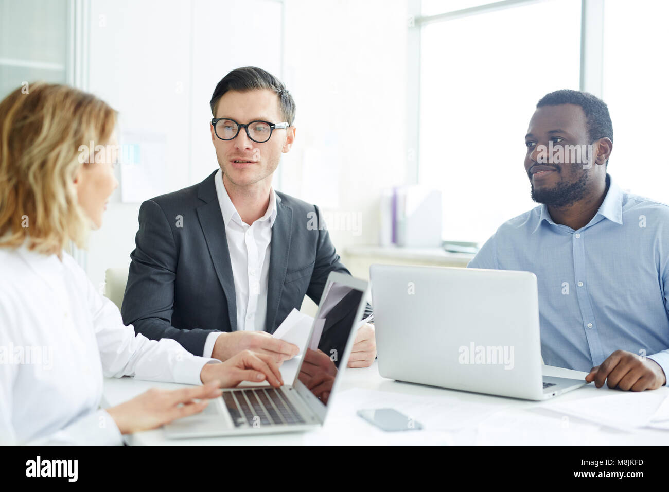 Discussing financial statistics Stock Photo - Alamy