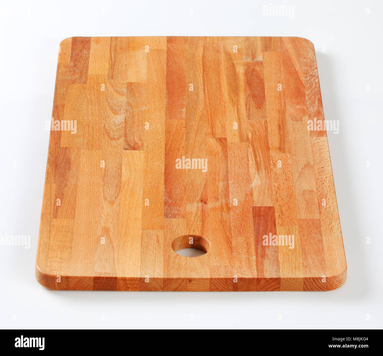 wooden cutting board with hole on white background Stock Photo - Alamy