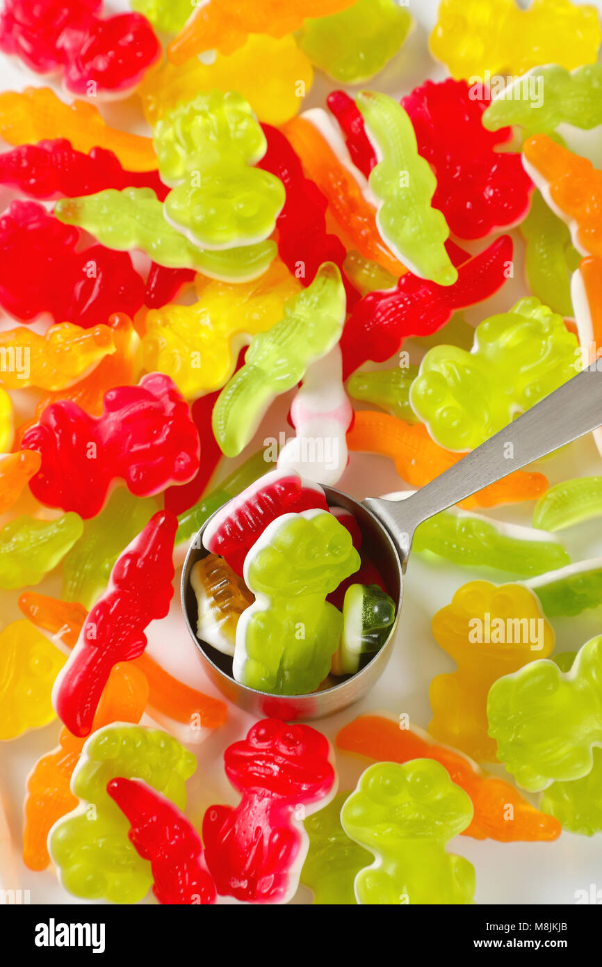 scoop of colorful gummy candies in the shape of animals Stock Photo - Alamy