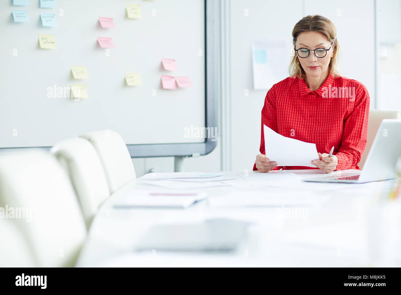 Woman boardroom alone hi-res stock photography and images - Alamy