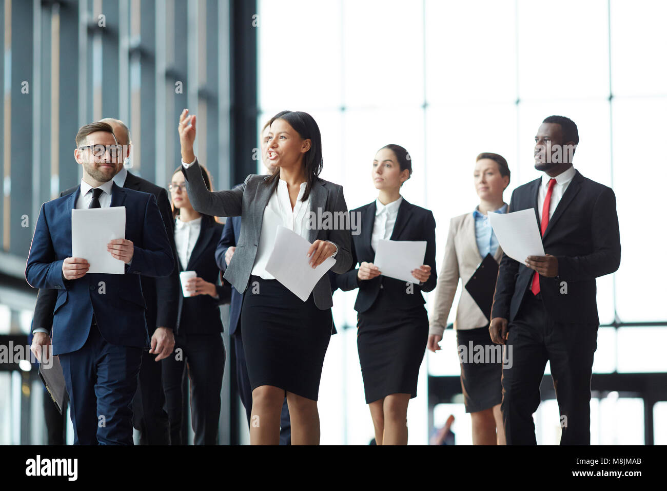 Delegates and guide Stock Photo - Alamy