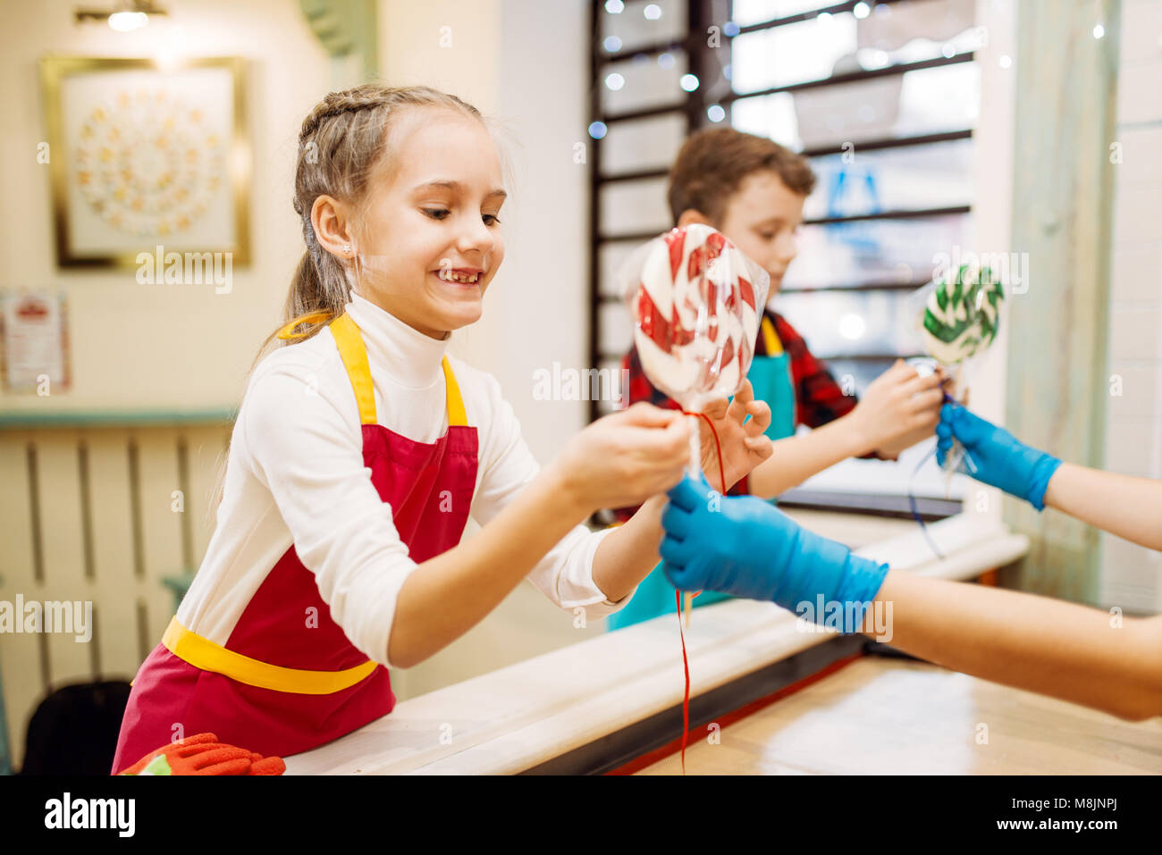 Lollipop preparation process, children get caramel. Holiday fun in ...