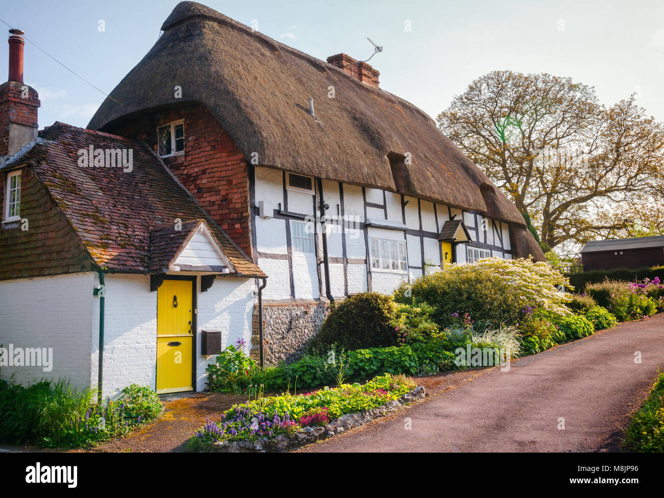 A typical traditional english country thatched cottage decorated with ...
