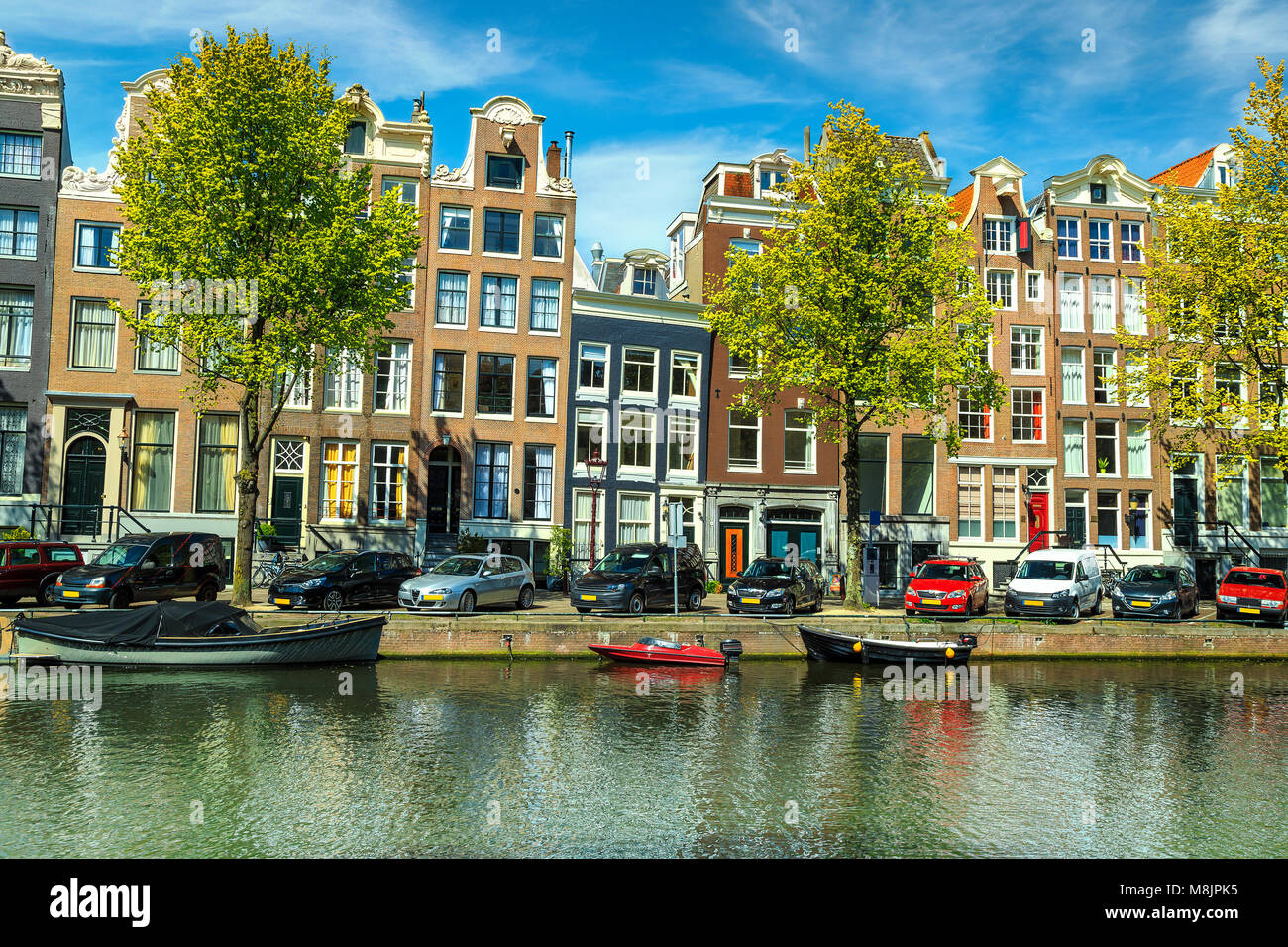 Amazing summer cityscape, traditional dutch buildings and water canal ...