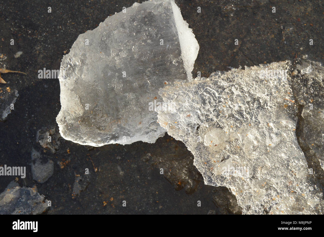 Transparent sparkling ice floes closeup, spring natural background ...