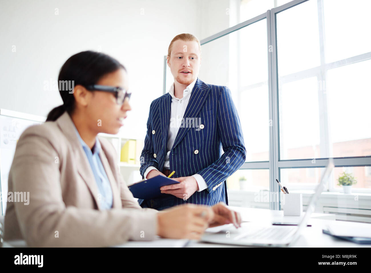 Businessman explaining document coworker hi-res stock photography and ...