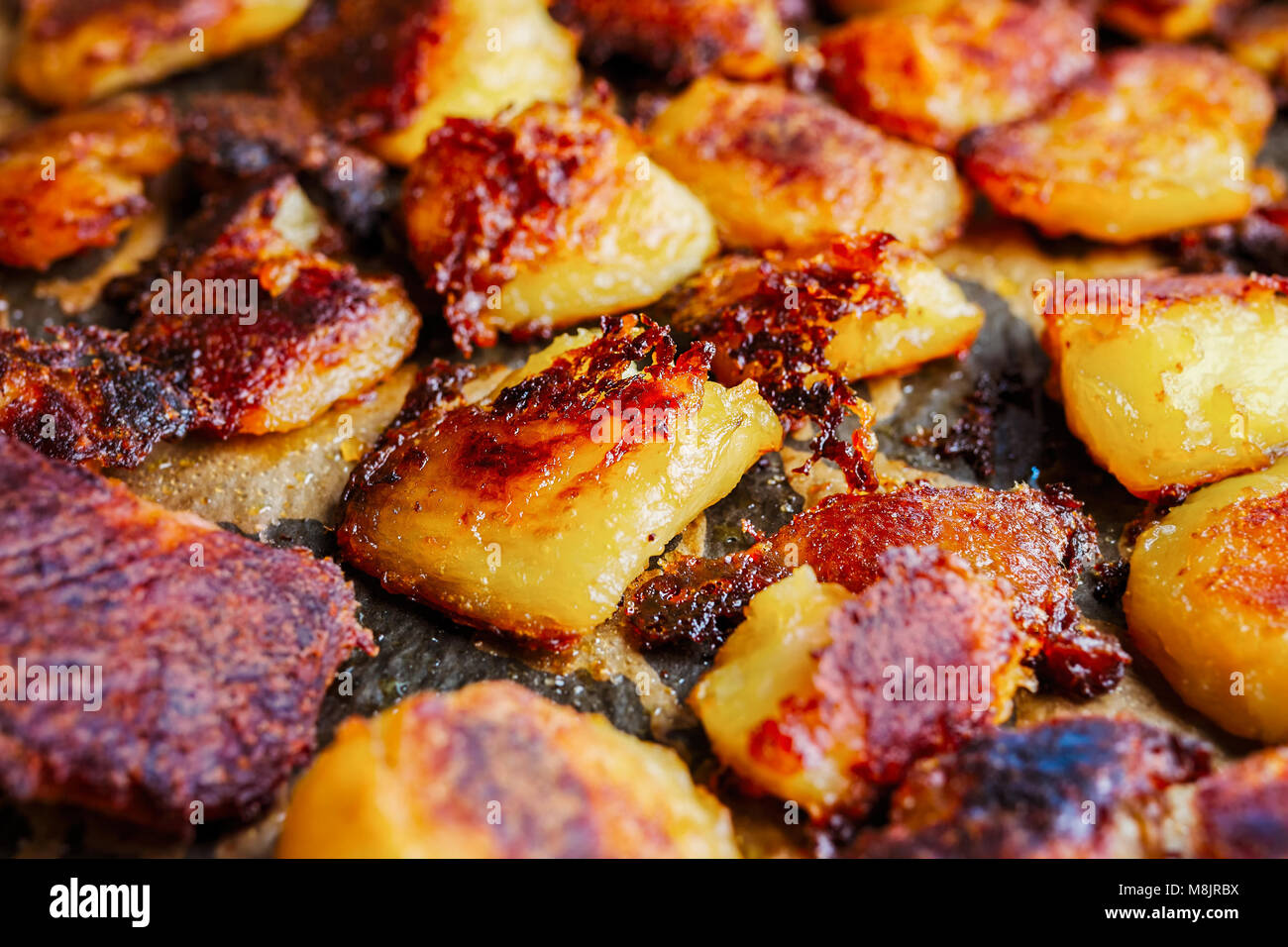 Roasted russet potatoes golden and crispy Stock Photo - Alamy