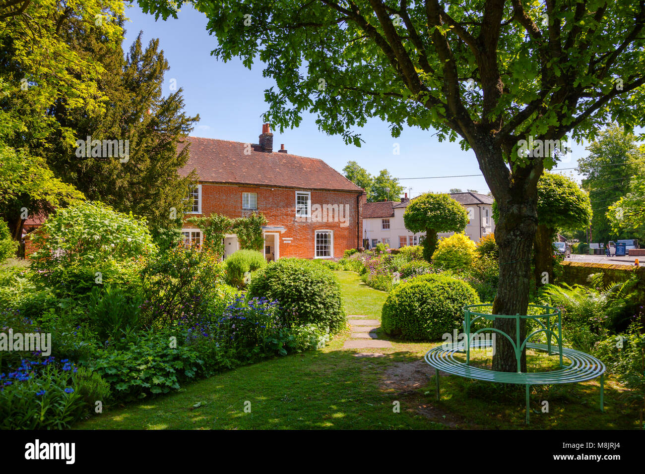 CHAWTON, UK - JUN 8, 2013: Round bench at formal garden of Chawton ...