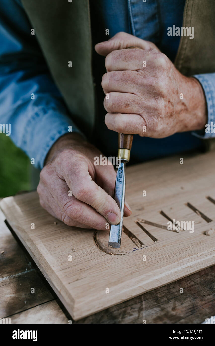 Bespoke sign maker artisan woodworker in England Stock Photo - Alamy