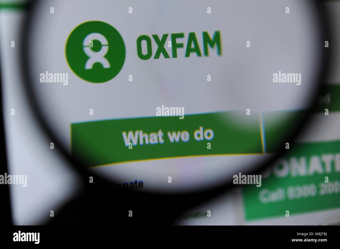 The Oxfam website seen through a magnifying glass Stock Photo - Alamy
