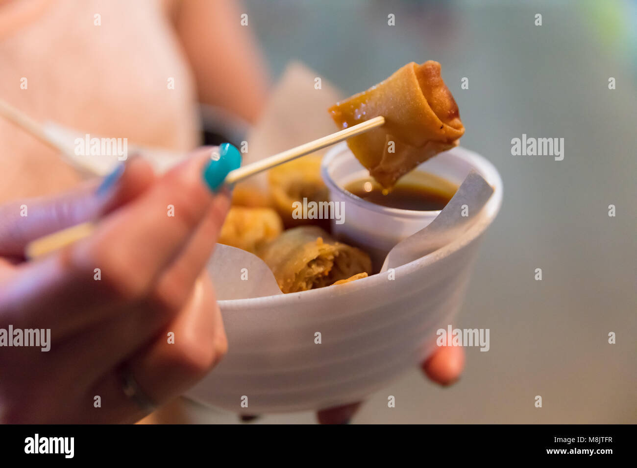 Woman Having Spring Rolls At Food Stall Stock Photo - Alamy