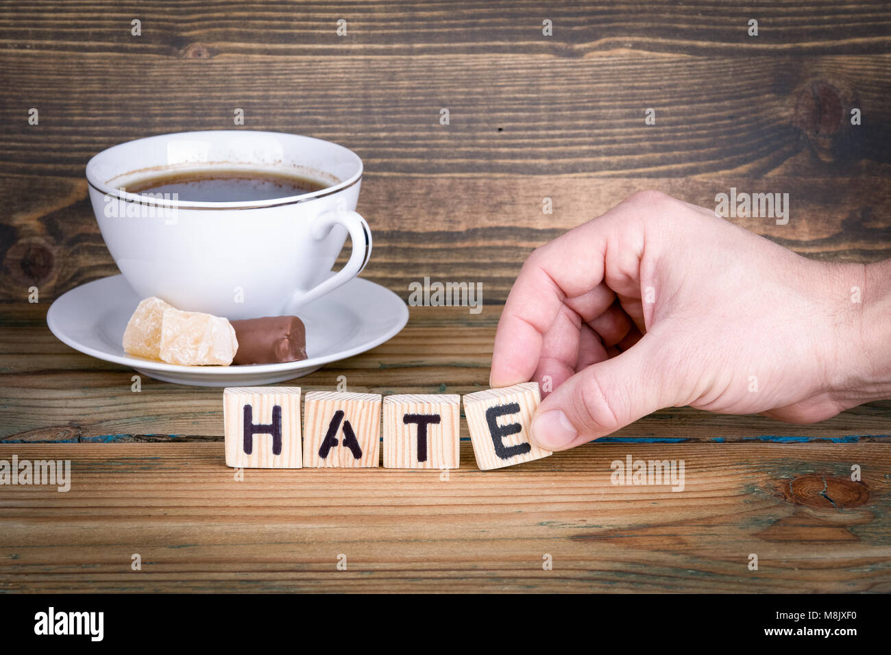 Hate. Wooden letters on the office desk, informative and communication ...