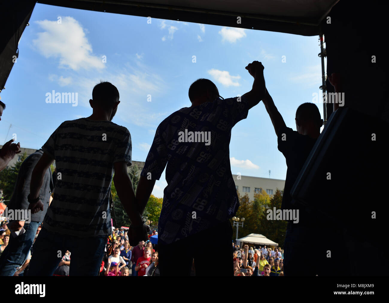 A judge rising up the hand of the winner of a competition Stock Photo ...