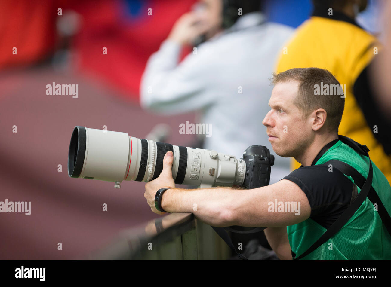 Professional sport photographer at an event Stock Photo - Alamy