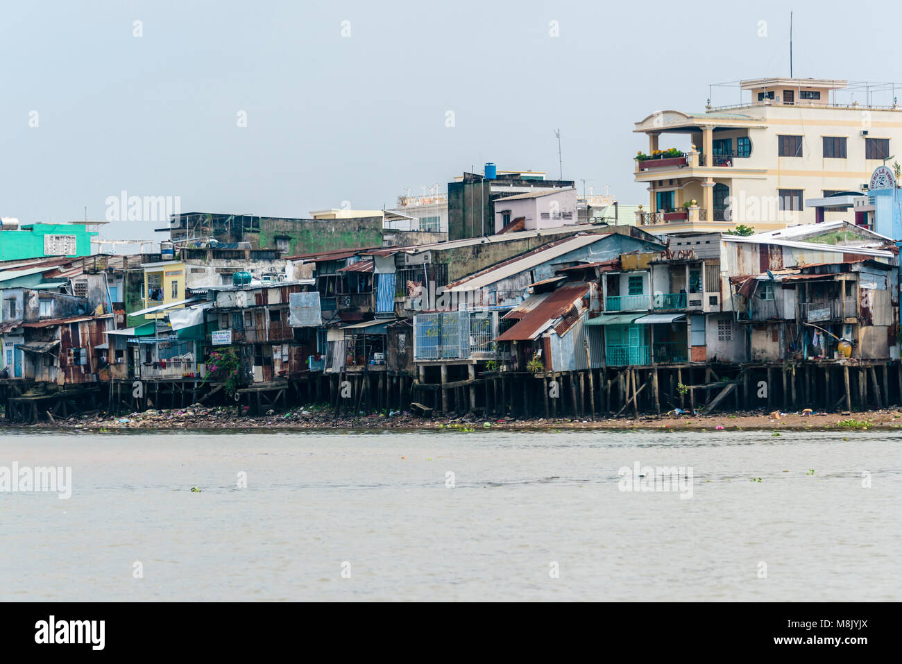 Makeshift houses on stilts made from corrugated iron, wooden sheets and ...