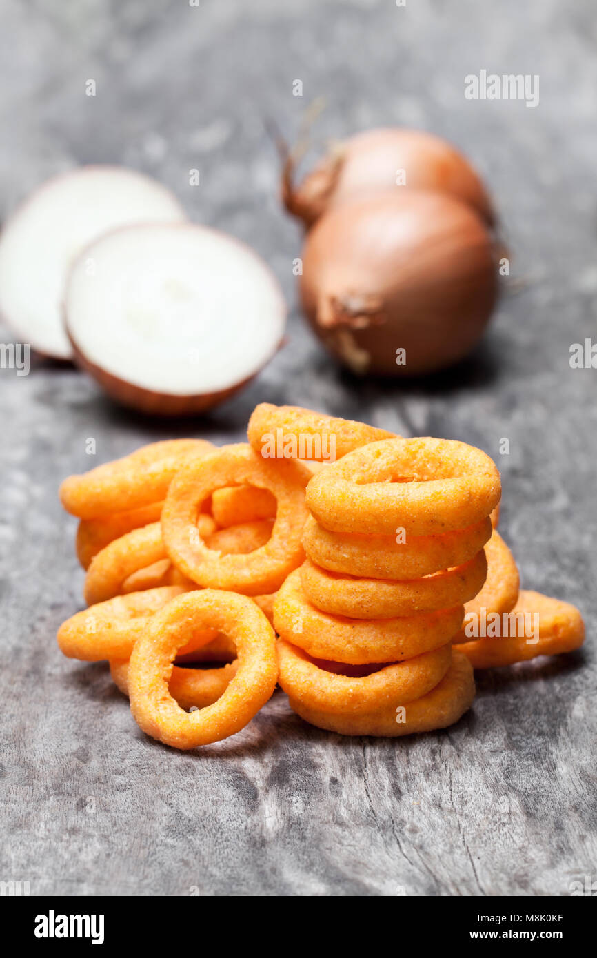 Crispy fried onion rings on wooden table Stock Photo - Alamy