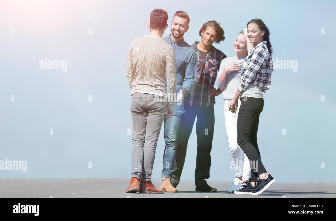creative team of friends talking outdoors Stock Photo - Alamy