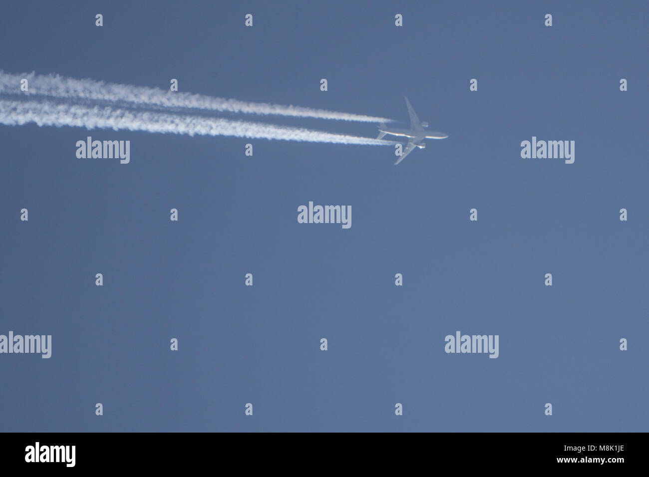 airplane in the sky flight high jet Stock Photo - Alamy