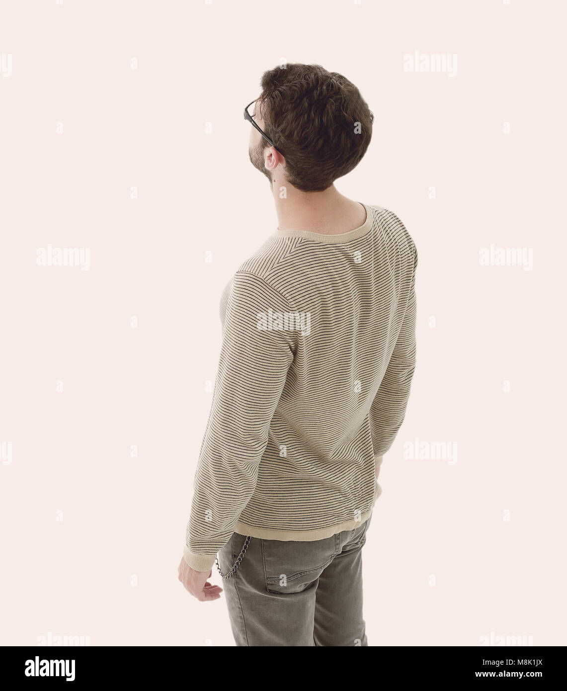 modern young man looks confidently forward. Photo in full length Stock ...