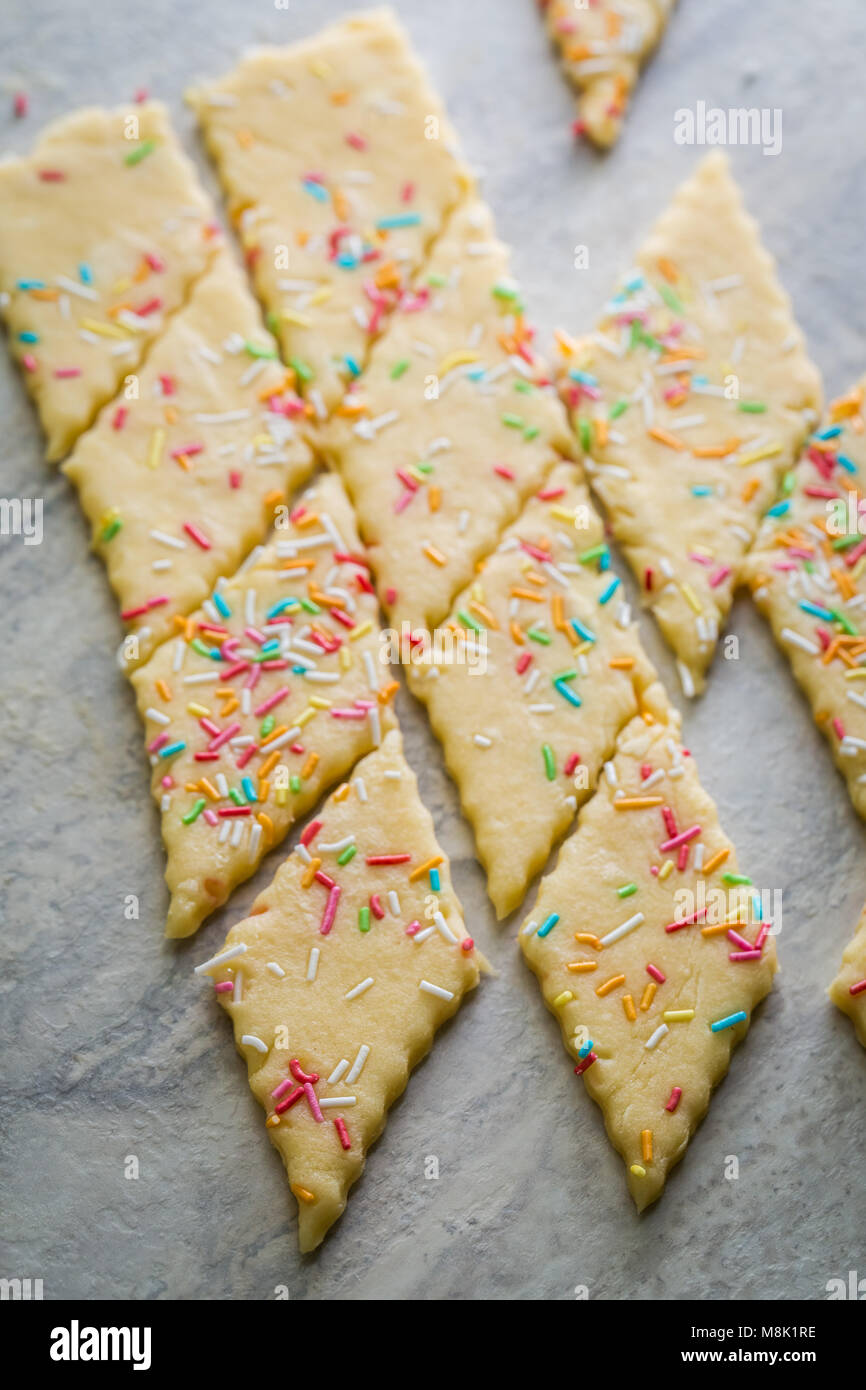 Sweet butter cookies with colored sprinkles on gray table Stock Photo ...