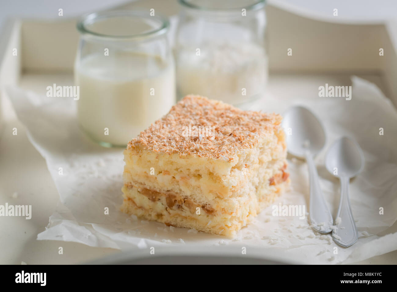 Tasty coconut cake with nuts and foam Stock Photo - Alamy