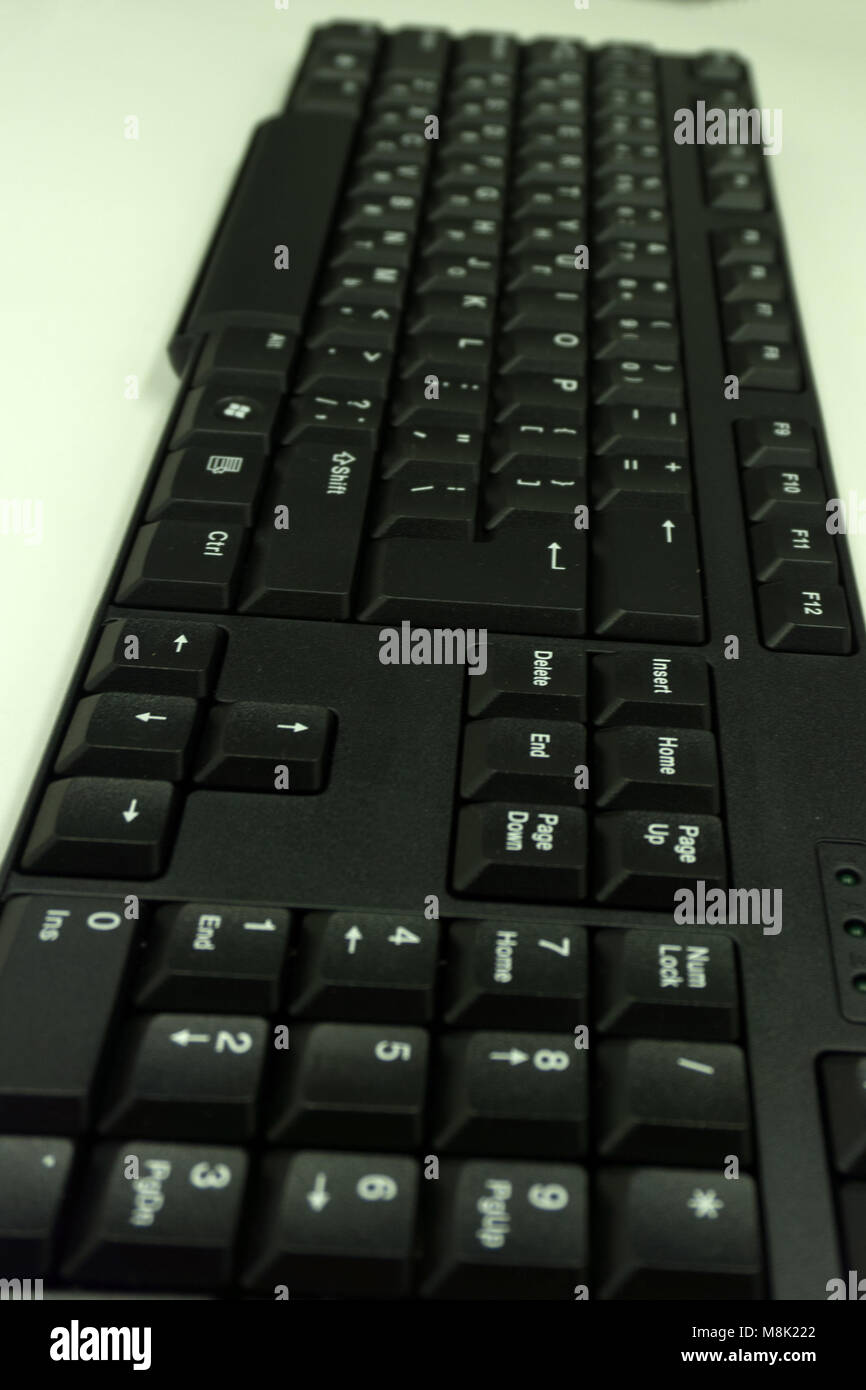 A plastic keyboard against a white background Stock Photo - Alamy