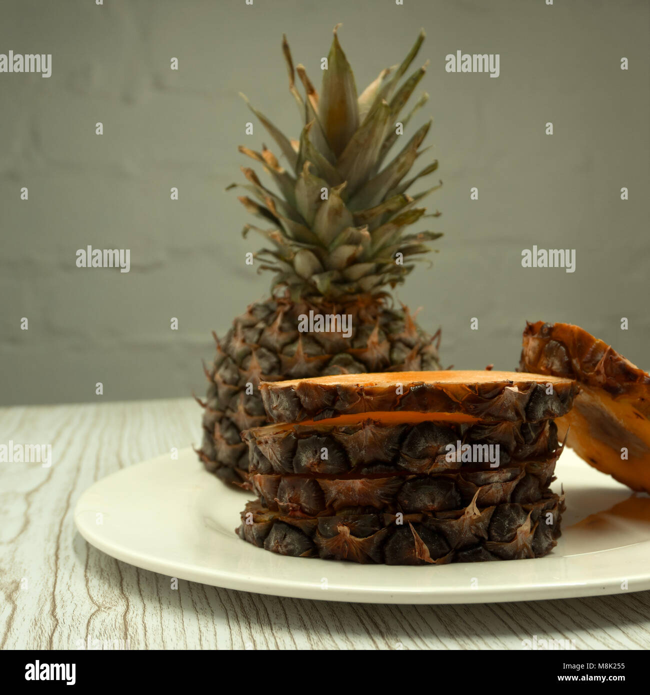 Sliced pineapple over white background Stock Photo - Alamy