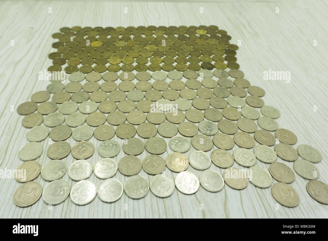 Close money, new coins, clean background. Bi-metal coin was introduced ...