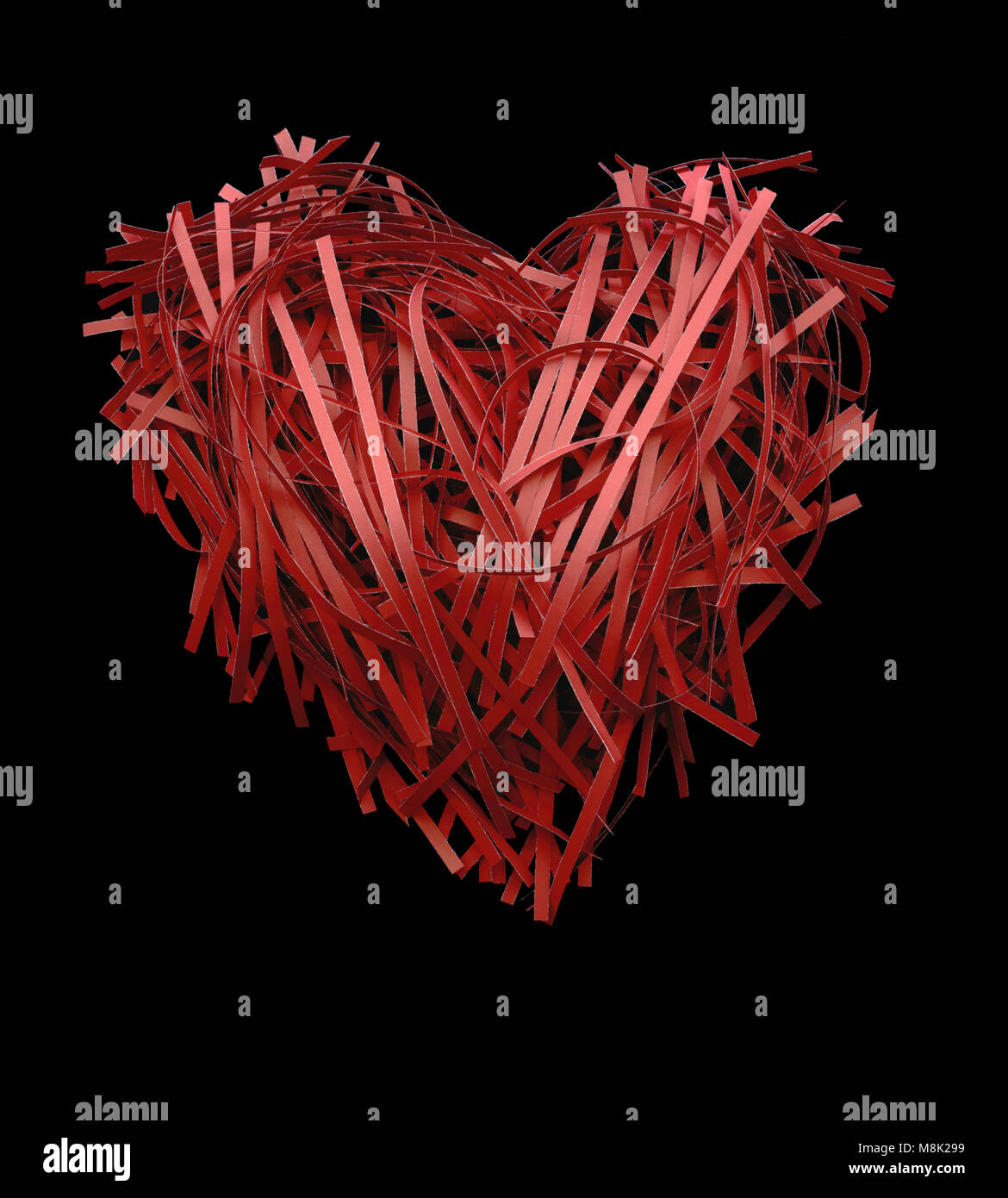 Shredded heart shape symbol on a black background Stock Photo - Alamy