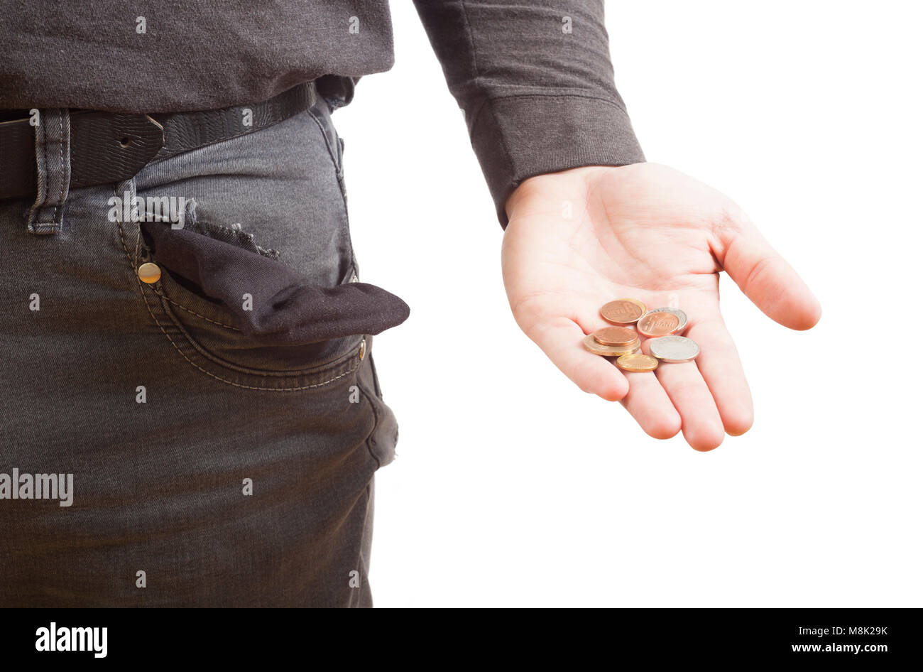 poor man hand holding coins and empty pocket Stock Photo - Alamy