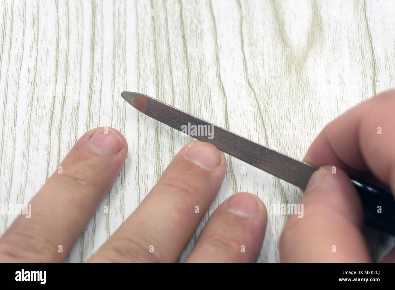 Man clean fingernails hi-res stock photography and images - Alamy