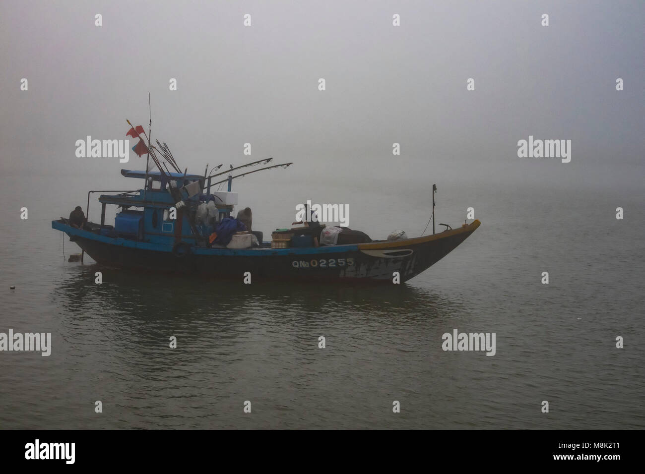 Fishing Boat in the Morning Mist Stock Photo - Alamy