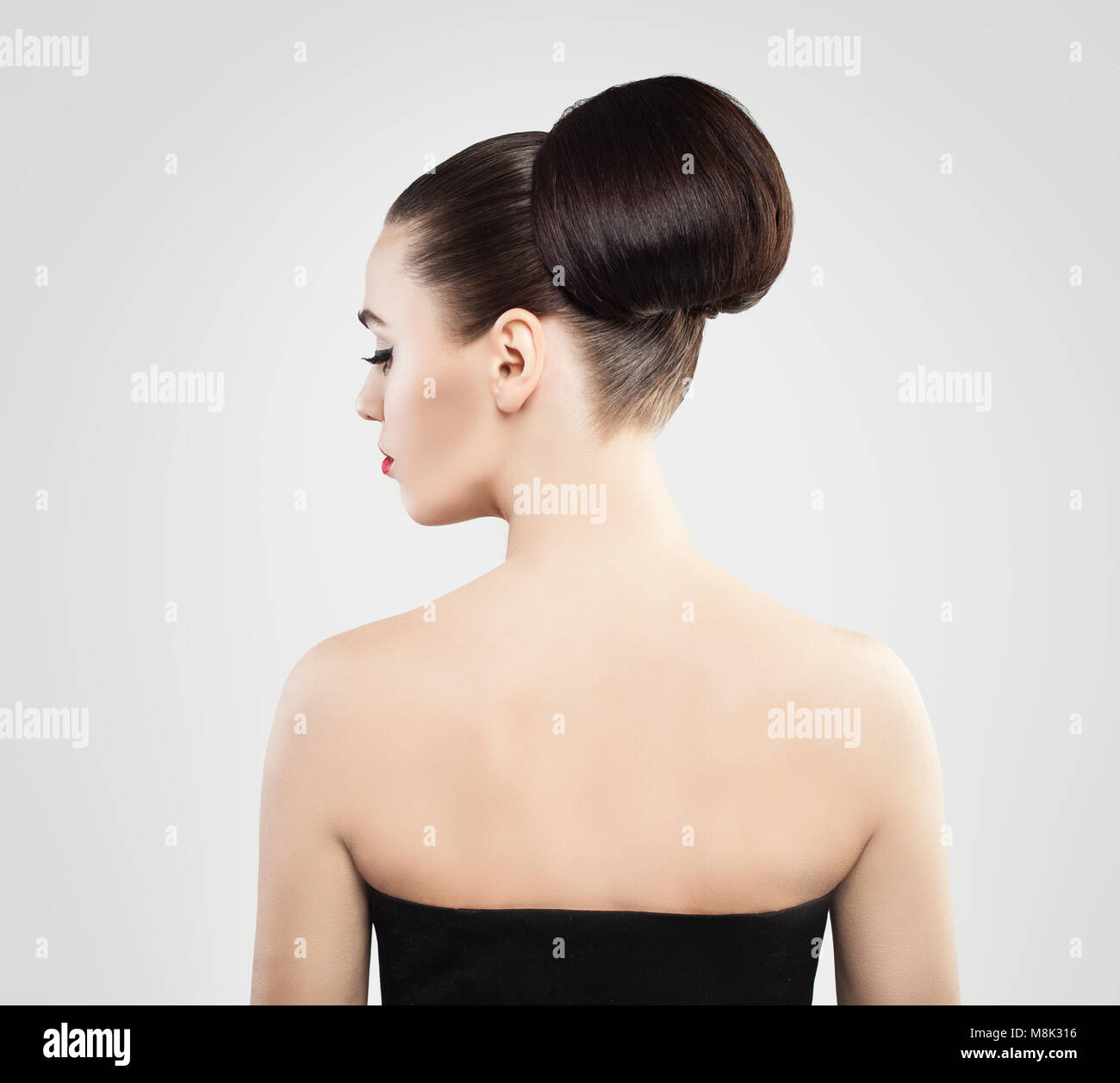 Woman with Updo Hair. Female Back Stock Photo - Alamy