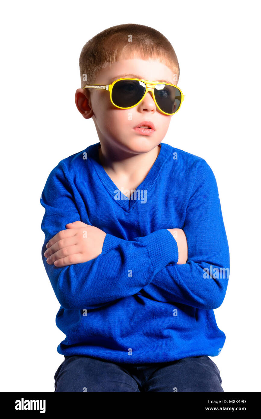 A boy in a blue jacket sits, isolated on a white background Stock Photo ...