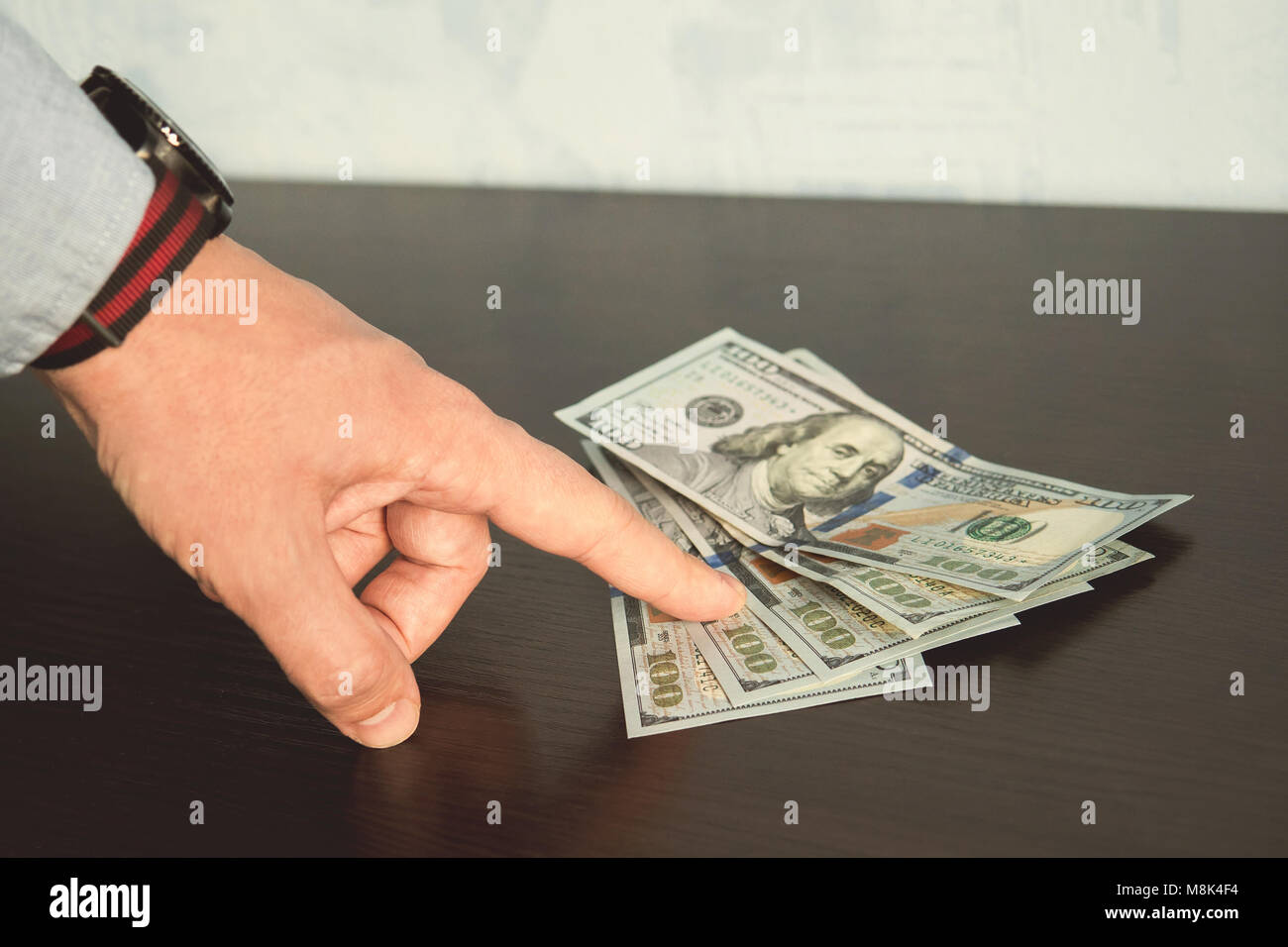 Wad of cash and man hi-res stock photography and images - Alamy